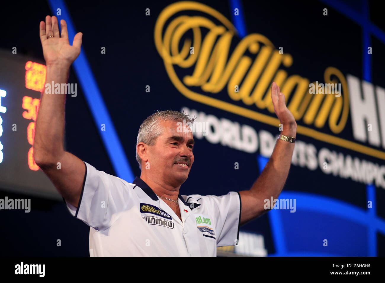 Steve Beaton waves to the fans as he walks onto stage for his match ...