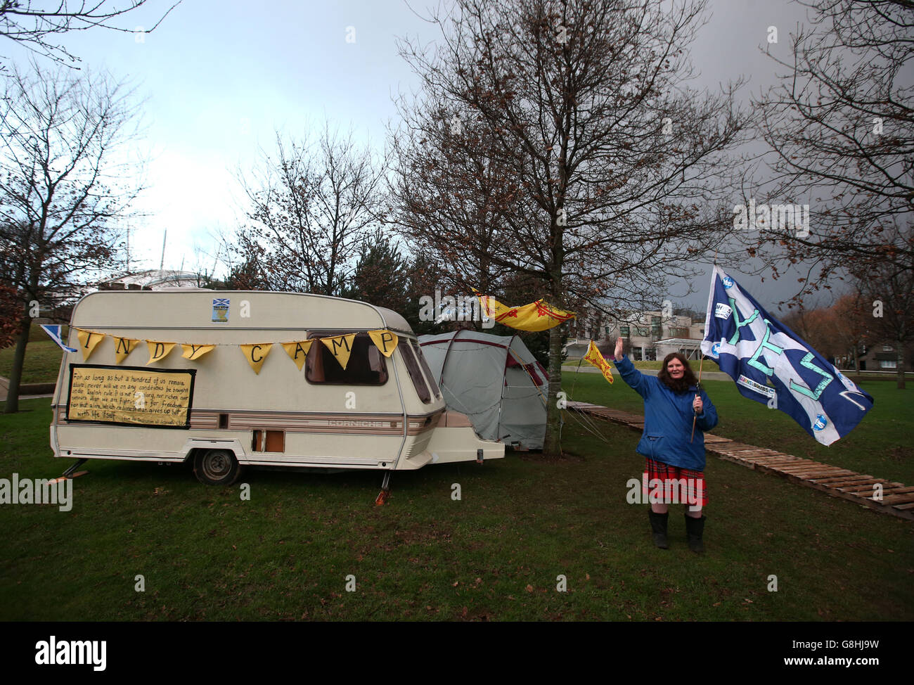 Gail Miller waves a Saltire flag next to her caravan at the ...