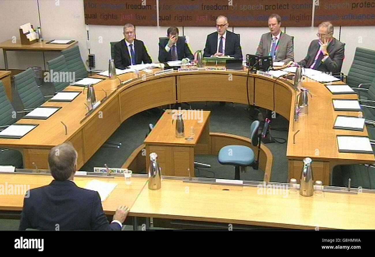 Former Prime Minister Tony Blair (back to camera) appearing in front of ...