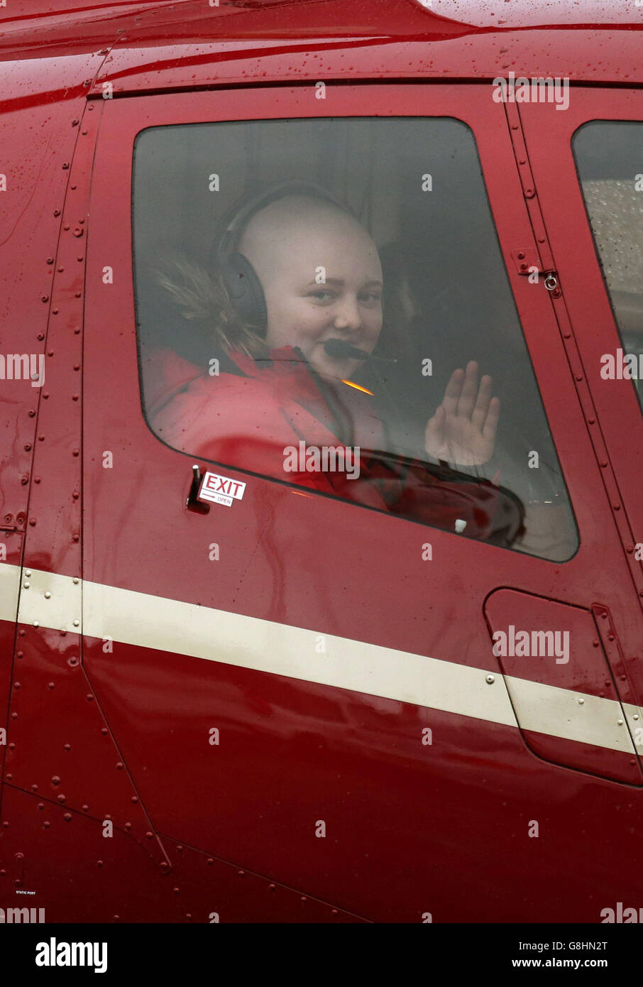 Helicopter Chemotherapy ride. Megan Fletcher waves from a helicopter ...