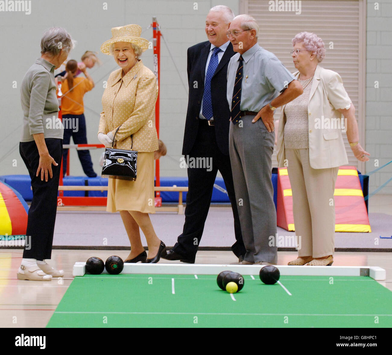 Britain's Queen Elizabeth II chats with members of the Leisurely ...