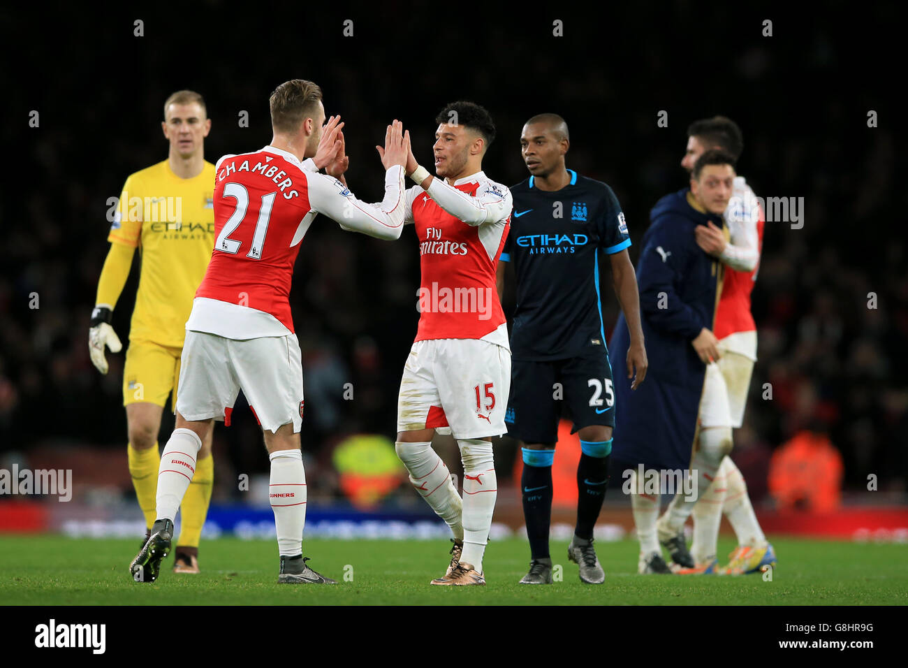 Arsenal's Calum Chambers and Alex Oxlade-Chamberlain (centre) celebrate victory after the final ...