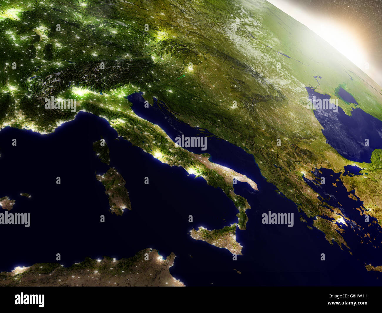 Italy with surrounding region during sunrise as seen from Earth's orbit ...
