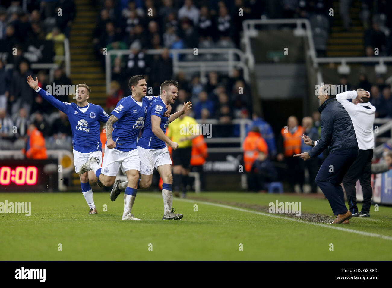 Everton's Tom Cleverly (right) celebrates scoring his side's first goal ...