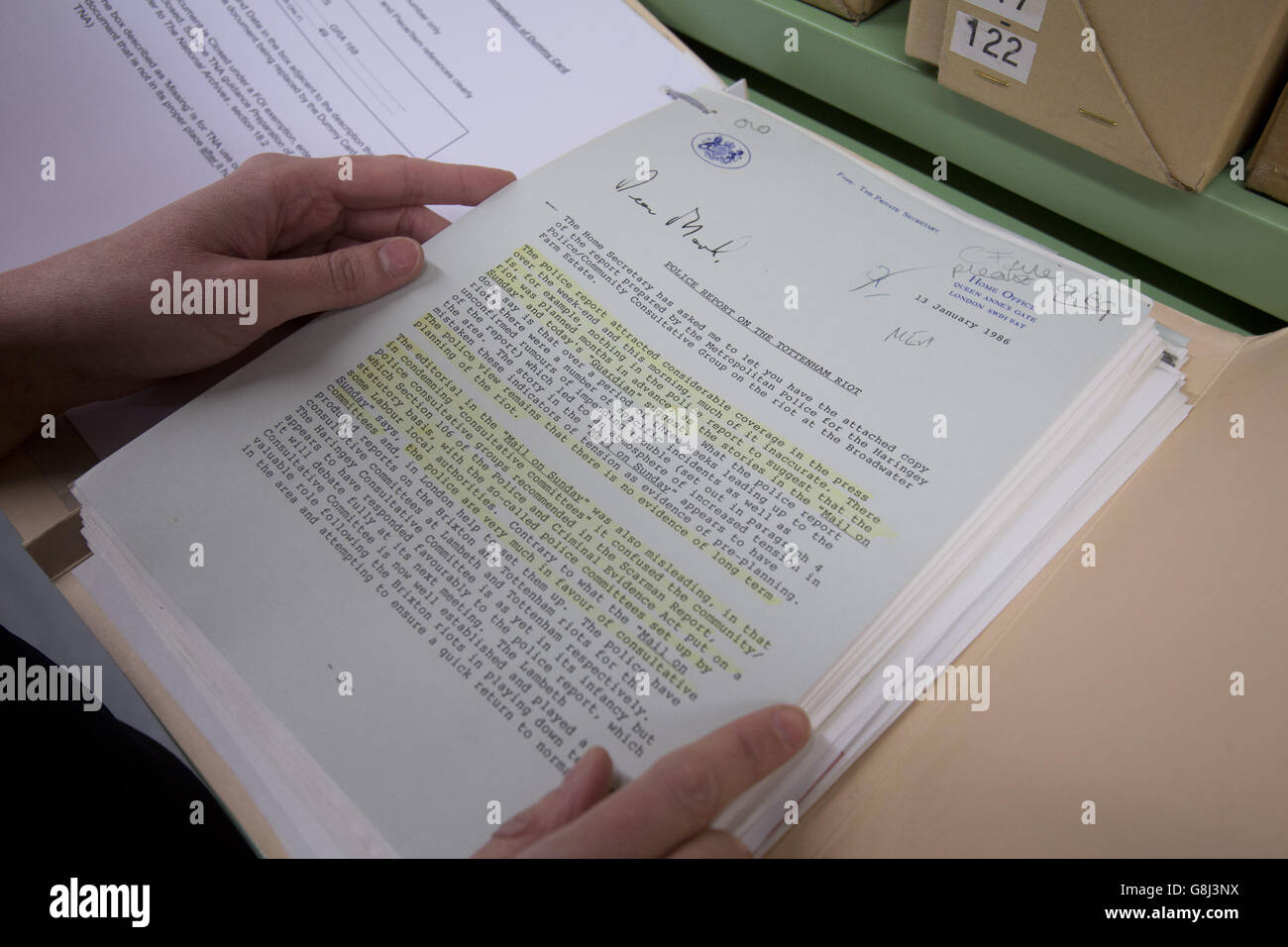 22/12/15 A member of staff at the National Archives in Kew holding Home ...