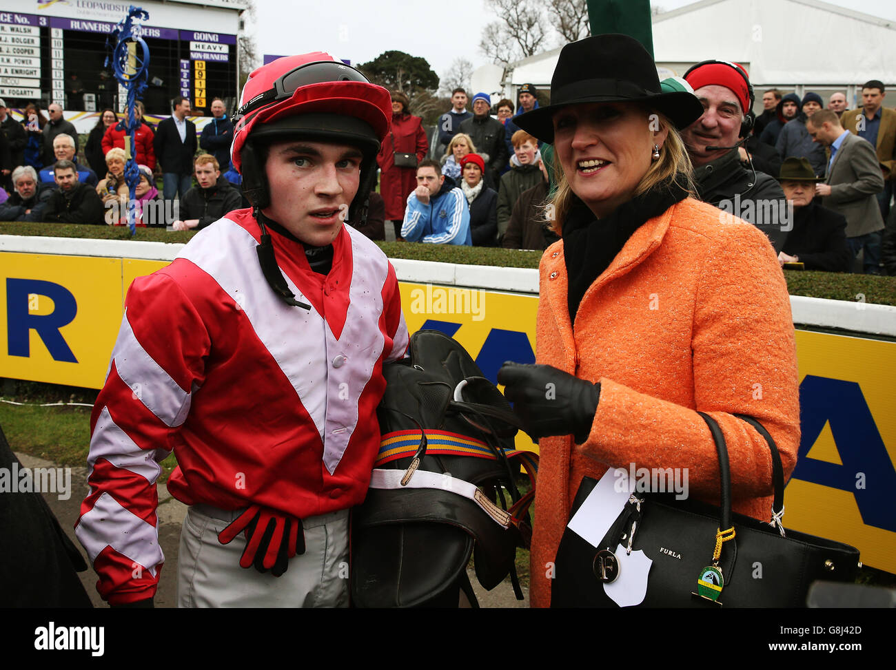 Winning jockey J.J. Burke and trainer Sandra Hughes in the parade ring ...