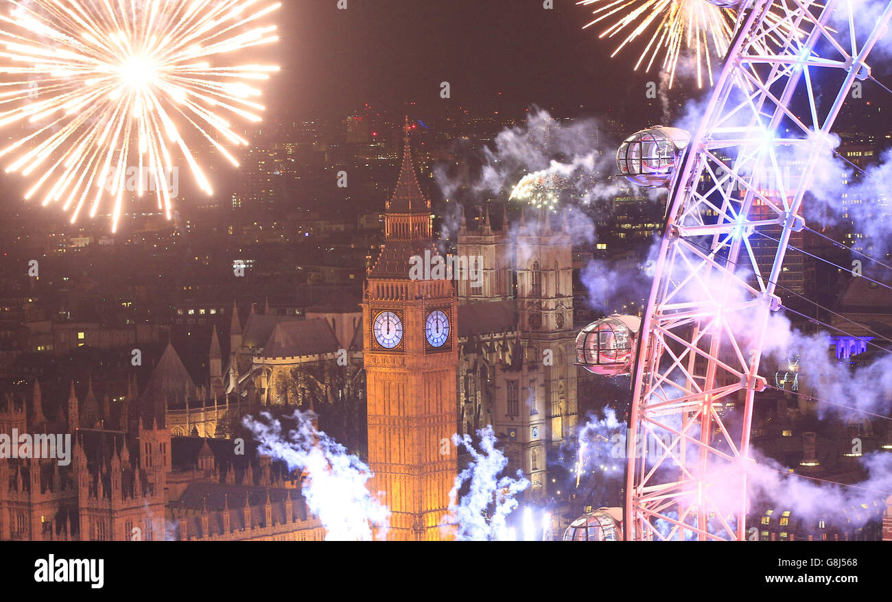 Fireworks light up the sky over the London Eye in central London during ...