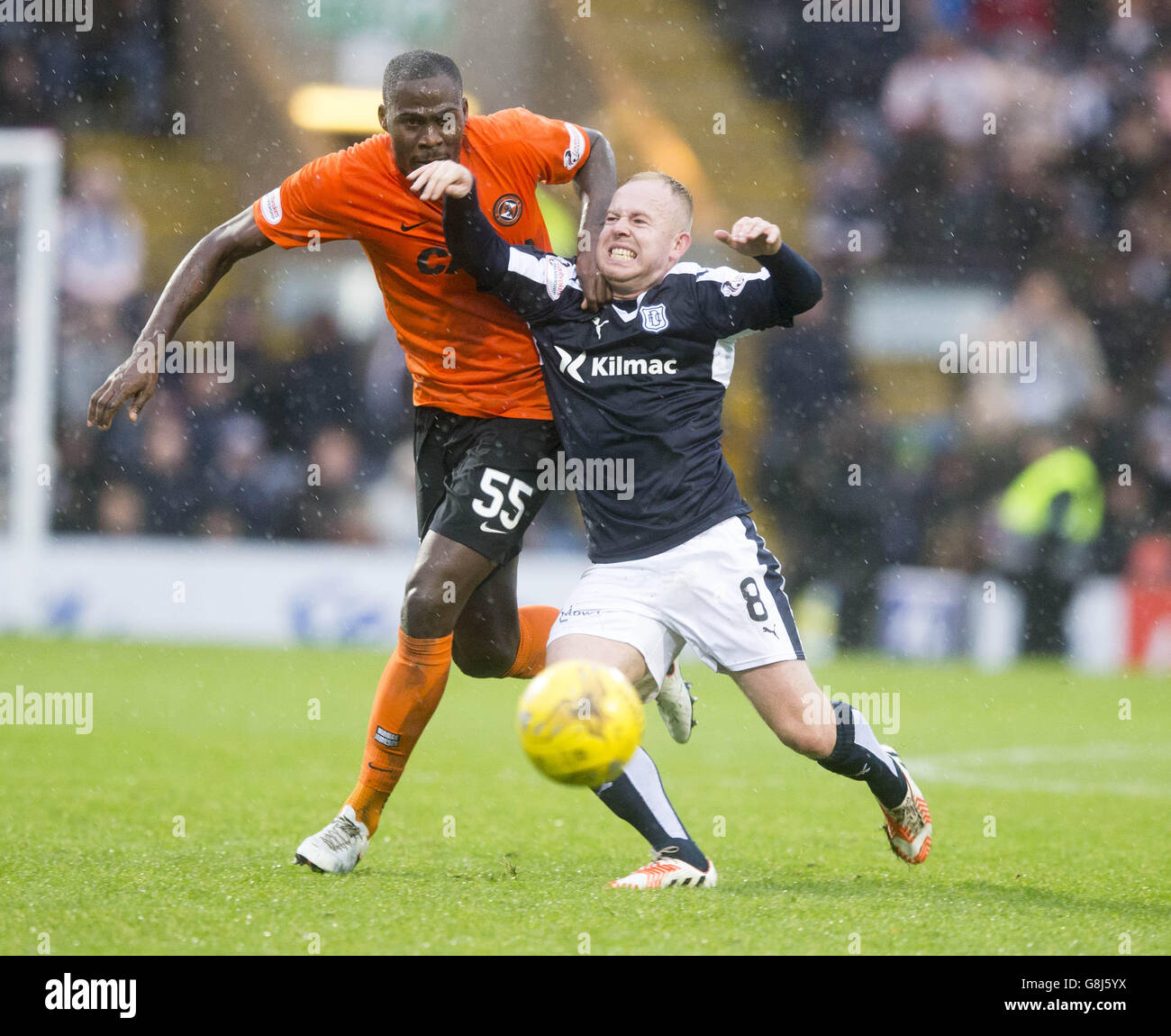 Dundee's Nicky Low (right) and Dundee United's Guy Demel battle for the ...