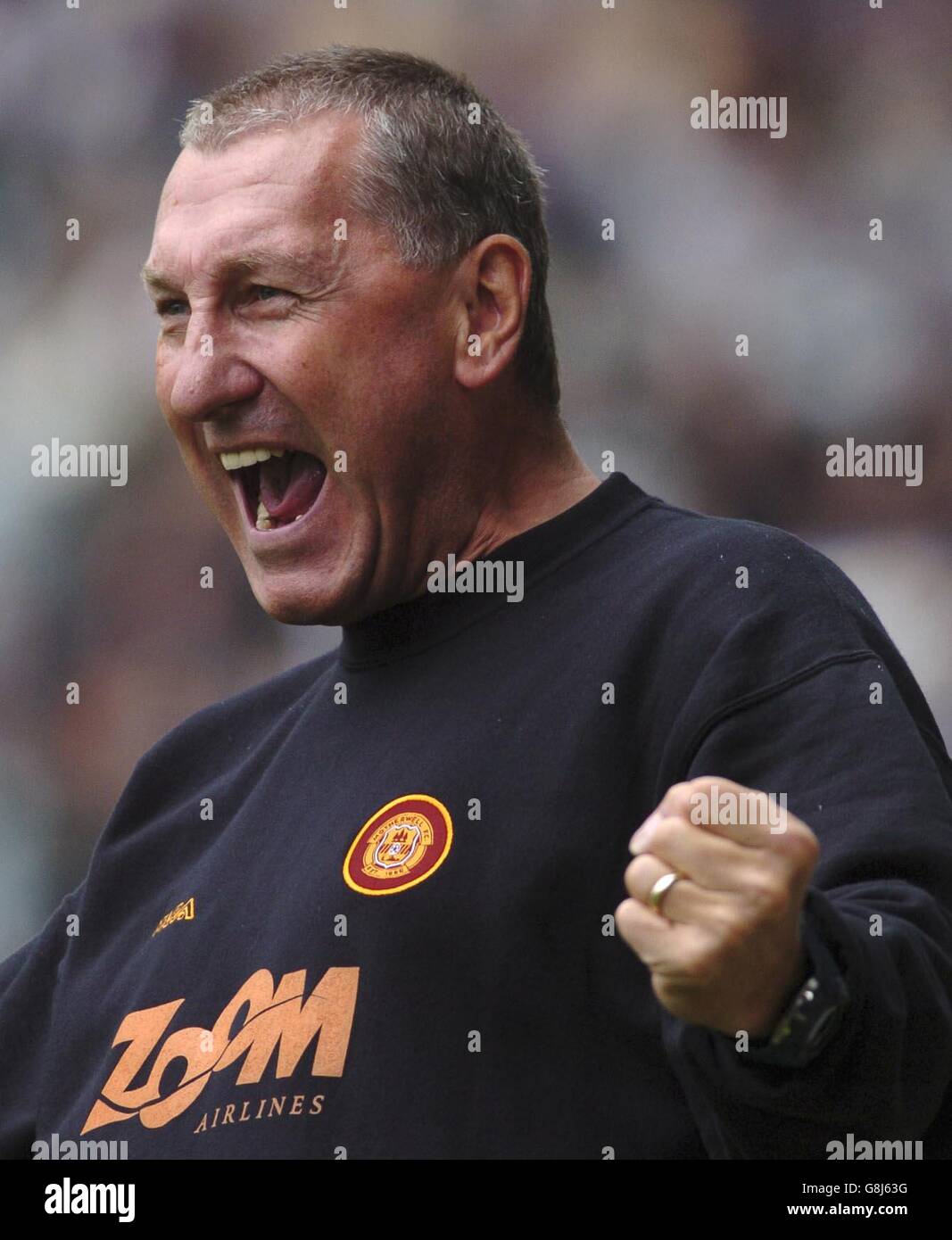 Motherwell's manager Terry Butcher celebrates Scott McDonald's goal ...