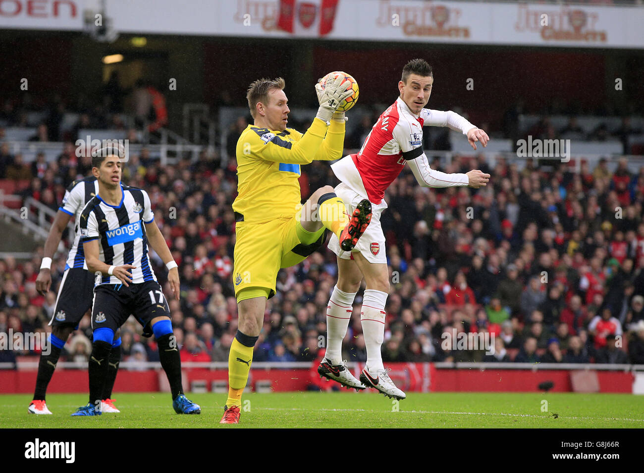 Arsenal's Laurent Koscielny (right) challenges Newcastle United ...