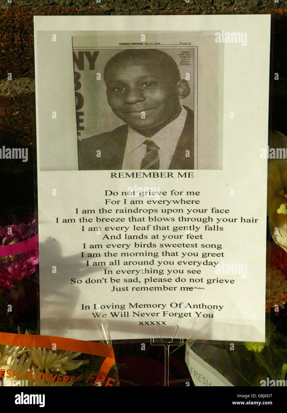A poem stands among flowers laid at the spot, where 18 year old Anthony ...