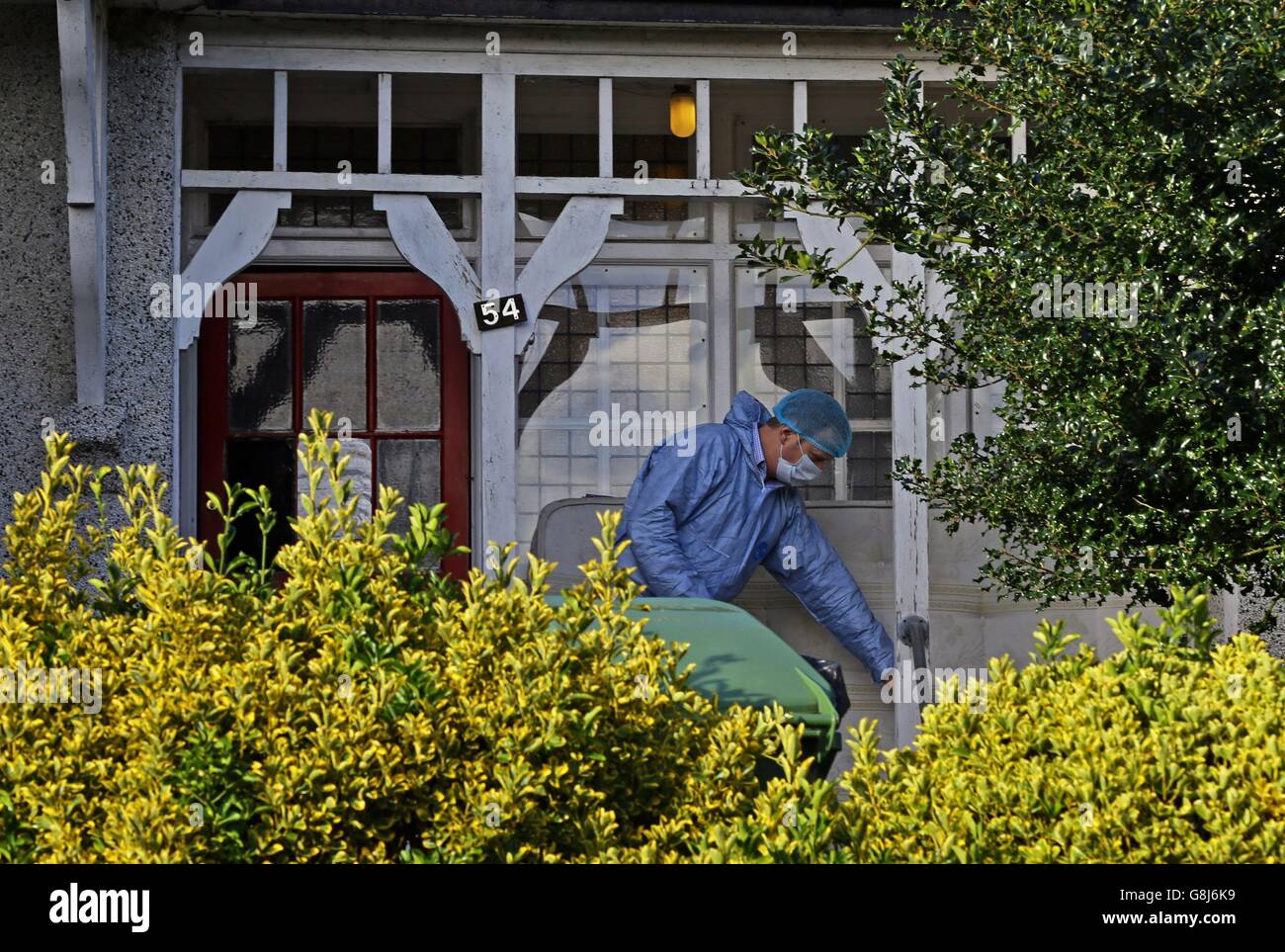 A police forensic officer leaves the house in Erith, Kent, which is ...