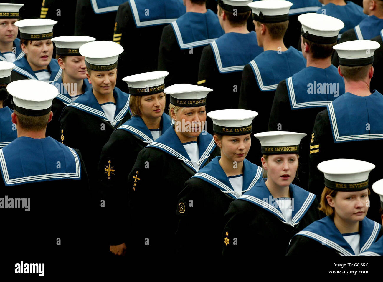 The crew of the former flagship of the Royal Navy HMS Invincible ...