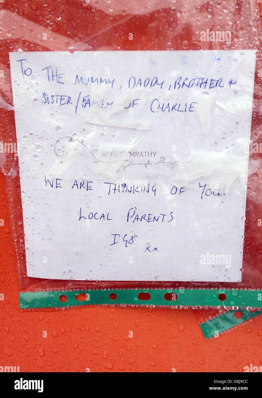 Tributes outside the entrance to Ashton Playing Fields in Woodford ...