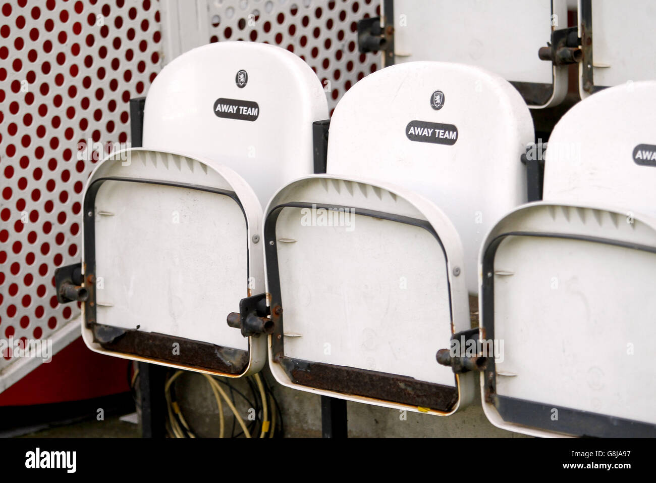 Detail of the away team bench seating hi-res stock photography and ...