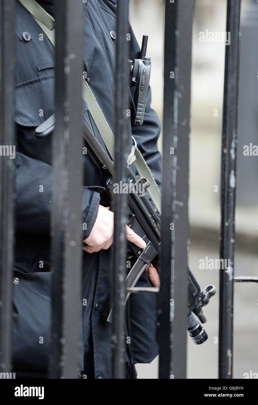A Metropolitan Police firearms officer stands in Westminster, London ...