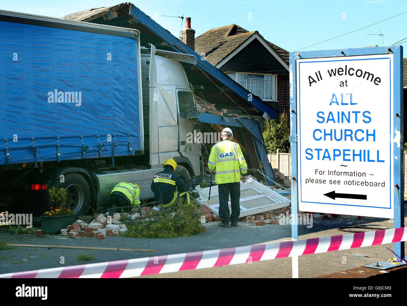 Police and fire officers investigate the scene after an articulated ...