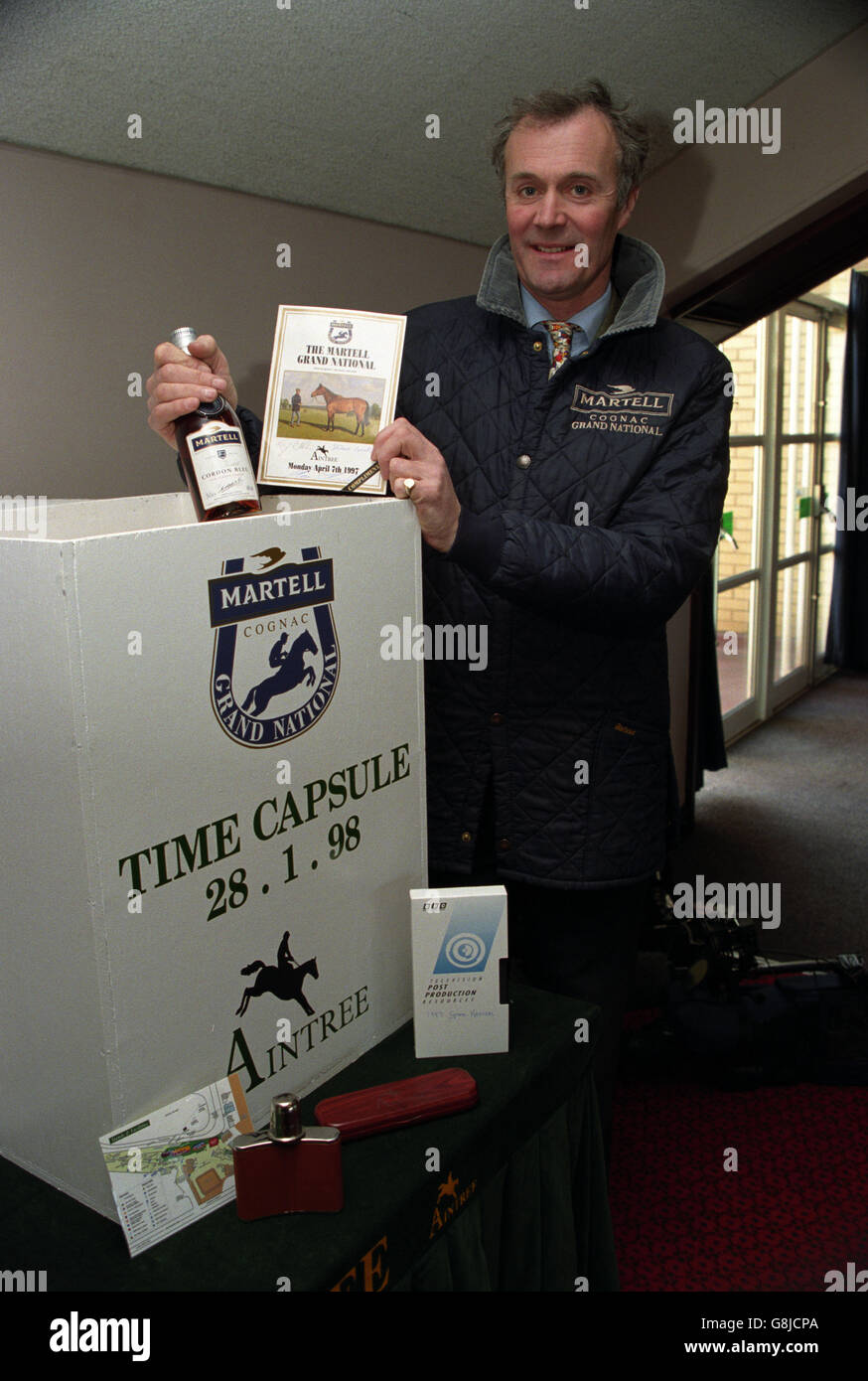 Charles Barnett, M.D. of Aintree Race Course, loads a time capsule ...