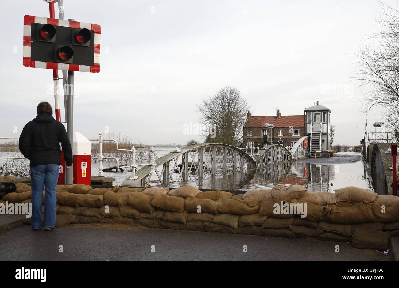 Locals look at flood water by Cawood Bridge in Cawood, between York and ...