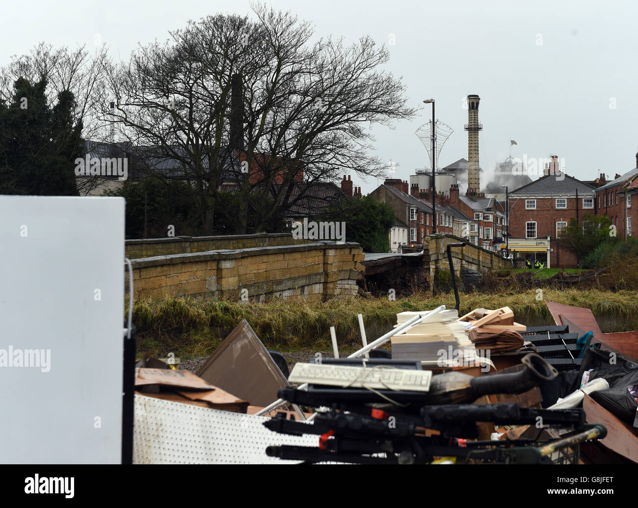 Flood damaged furniture outside a garage by the bridge in Tadcaster ...