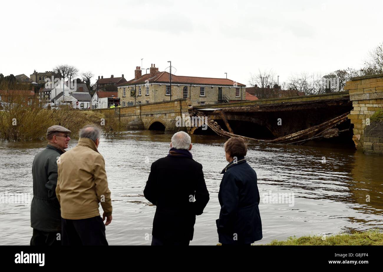 Locals look at the bridge in Tadcaster, North Yorkshire, which has ...