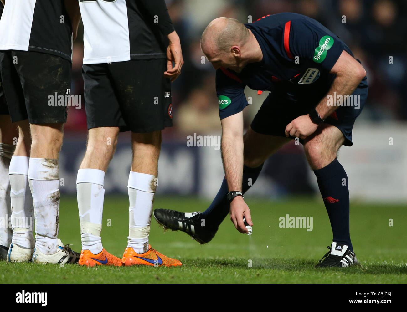 Referee Bobby Madden uses his vanishing spray to mark where the wall ...