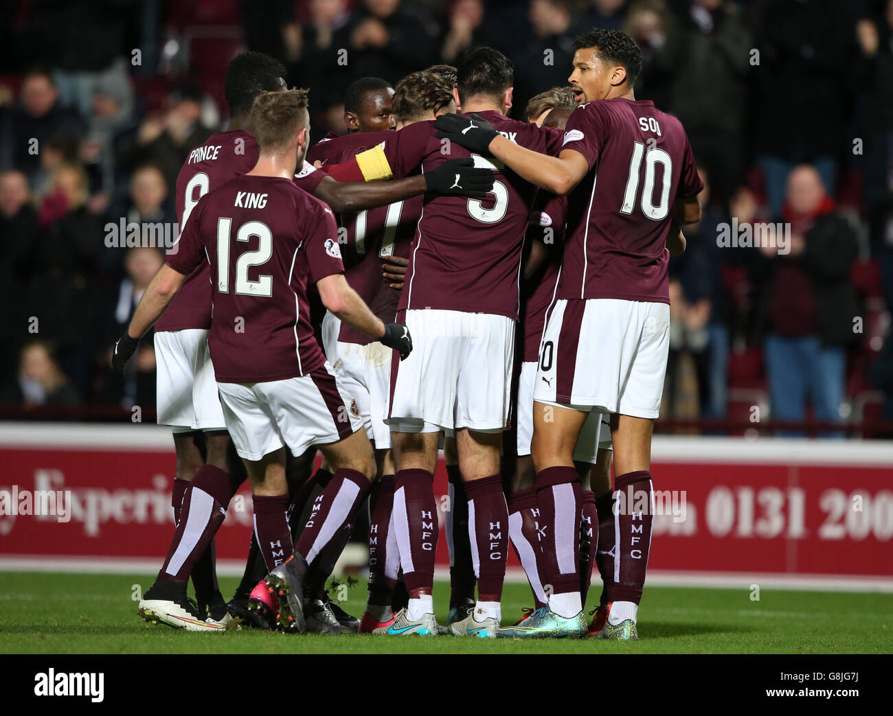 Heart of Midlothian's Gavin Reilly (centre hidden) celebrates scoring ...