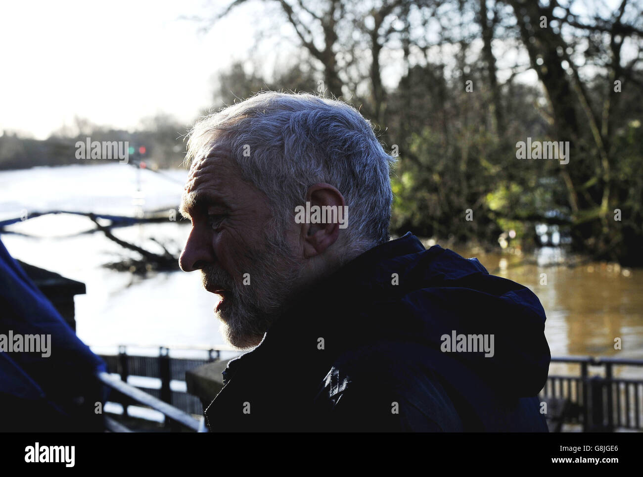 Labour leader Jeremy Corbyn looks at flood water at the Foss Barrier ...