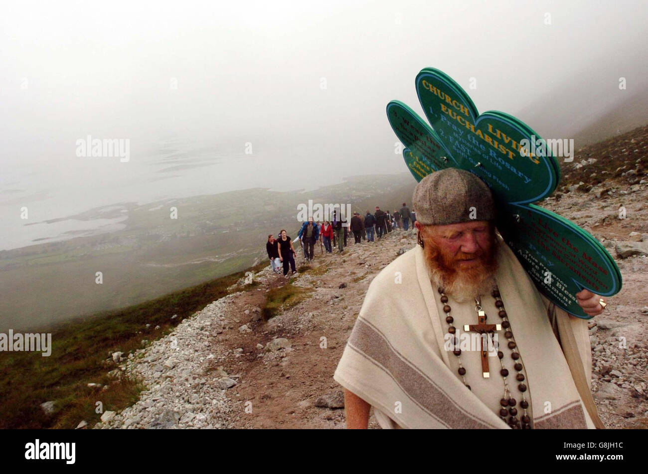 An unnamed pilgrim during his ascent of the 765M Croagh Patrick in Co ...