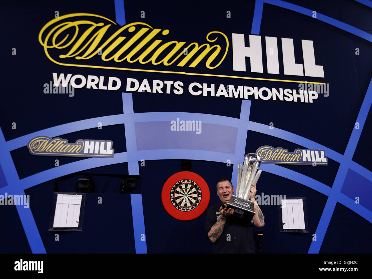 Gary Anderson celebrates with the Sid Waddell trophy after winning the ...