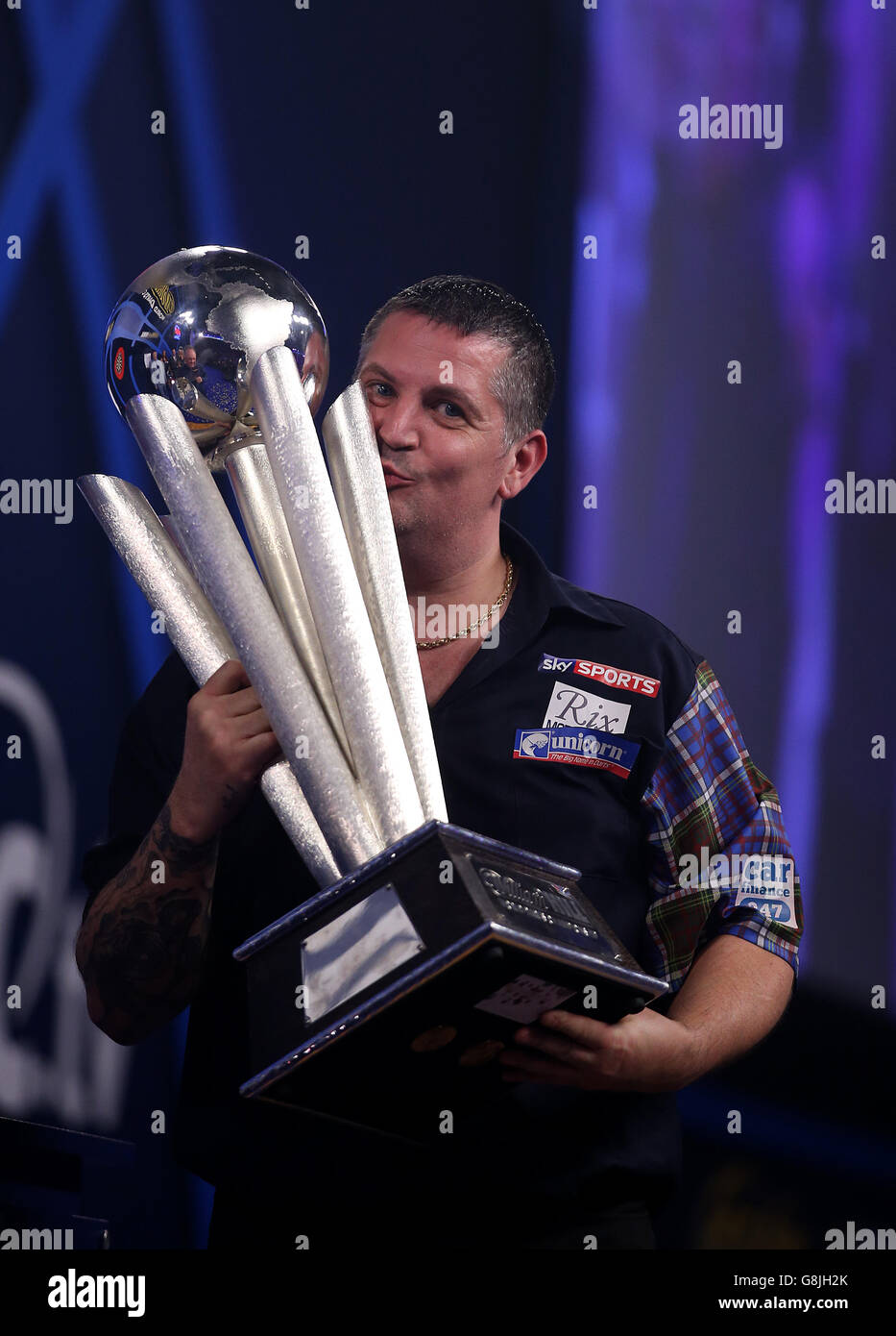 Gary Anderson celebrates with the Sid Waddell trophy after winning the ...