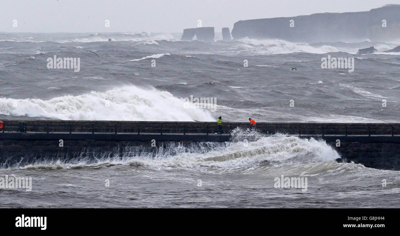 Fishermen brave the rough seas on the South Shields Pier near Newcastle ...