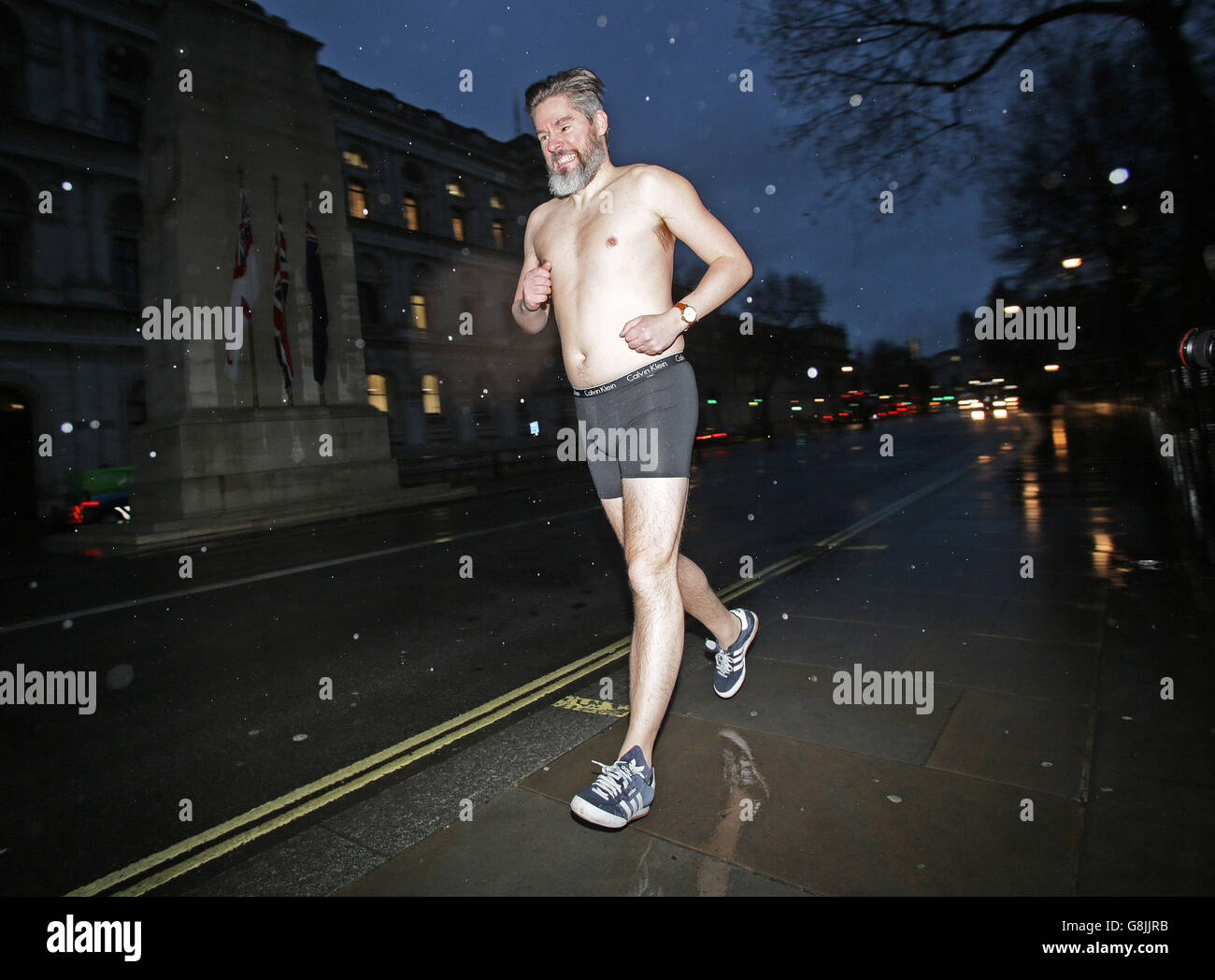 Daily Telegraph political journalist Dan Hodges streaks down Whitehall, London, after losing a ...