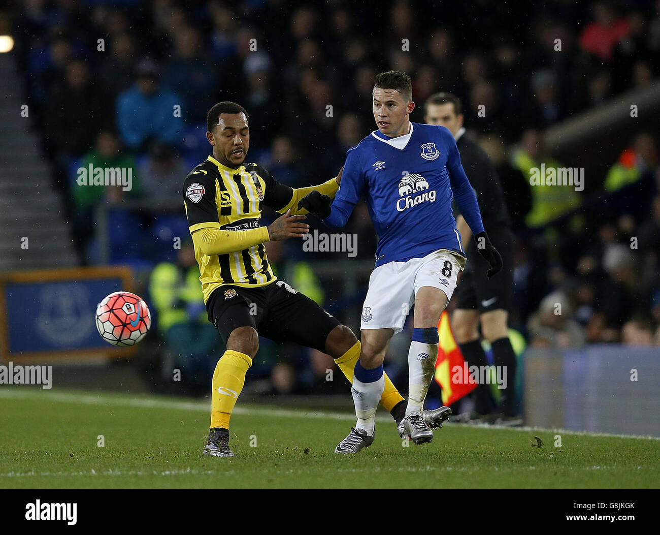 Dagenham and Redbridge's Ashley Hemmings (left) and Everton's Bryan ...