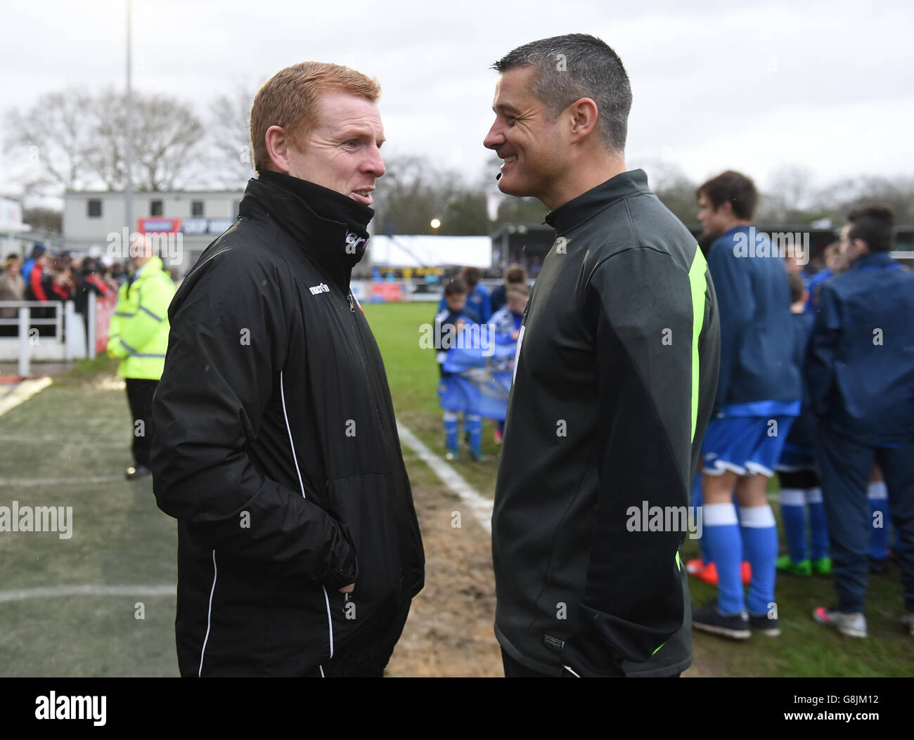 Bolton Wanderers manager Neil Lennon (left) chats with referee Iain ...