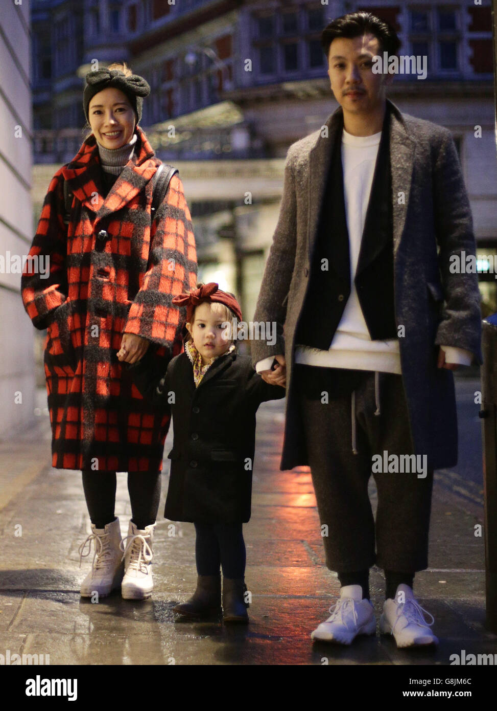 Kiwi Mai, two-year-old Devly Mai and Edison Kang attend the Matthew ...