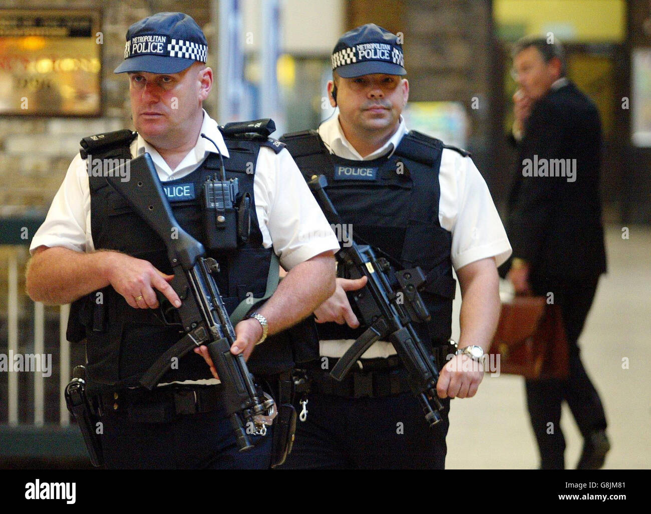 Armed police on patrol at londons kings cross station hi-res stock ...