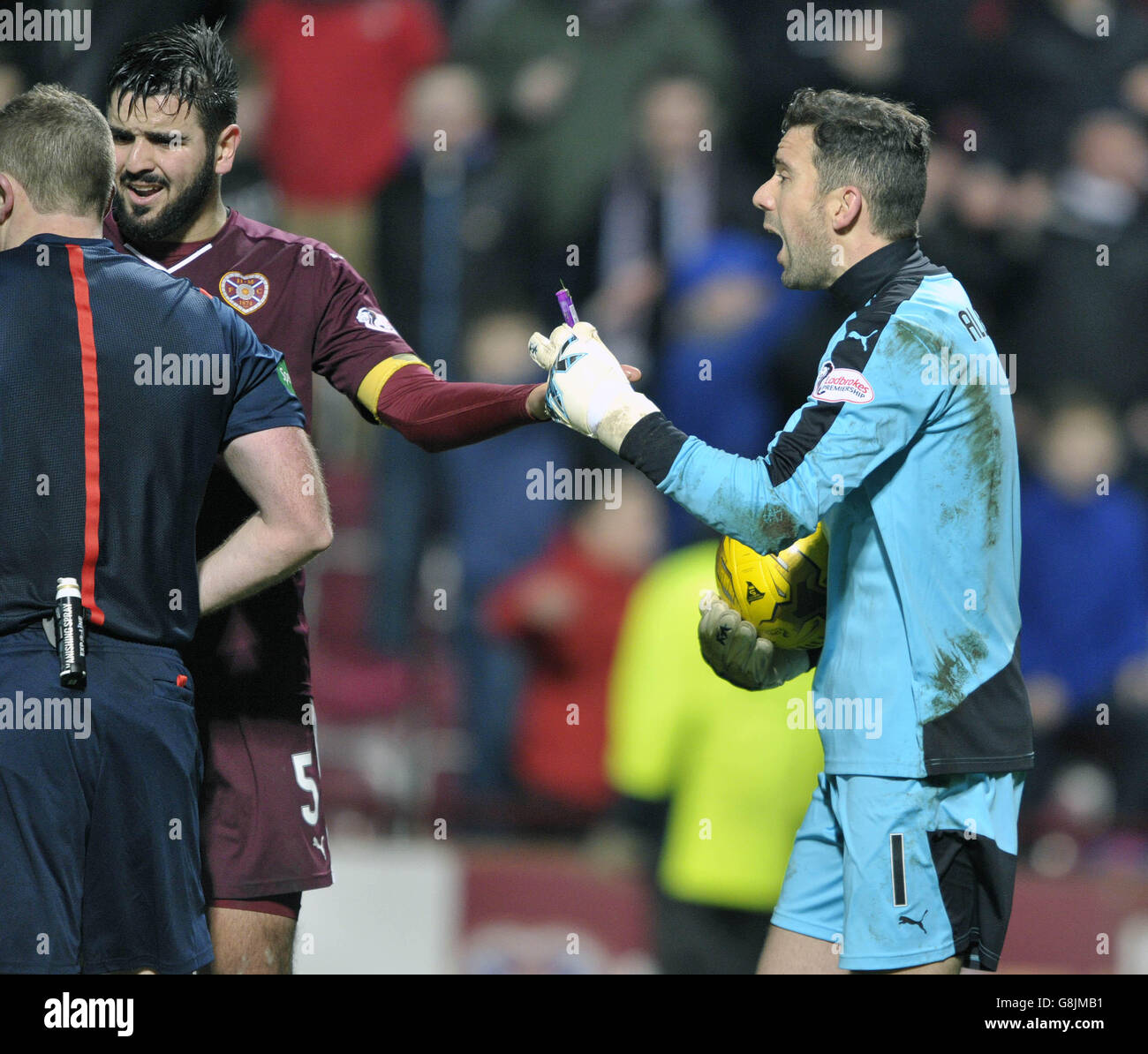 Heart of Midlothian goalkeeper Neil Alexander (right) and Alim Ozturk ...