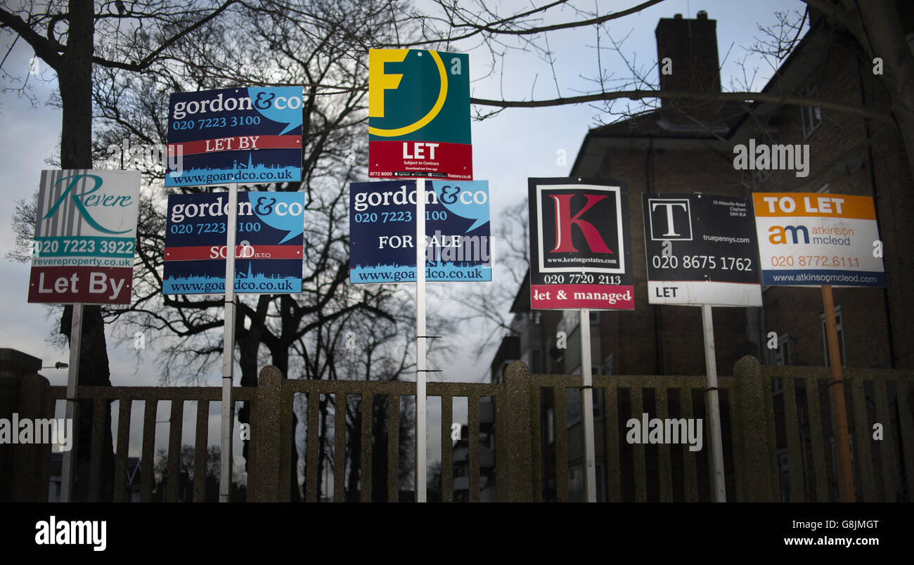 Estate agents boards Stock Photo - Alamy