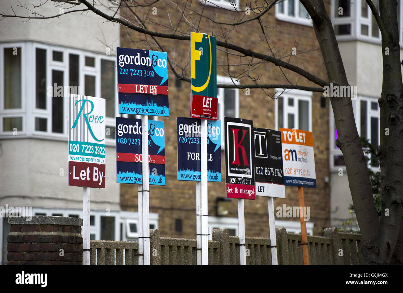Estate agents boards Stock Photo - Alamy