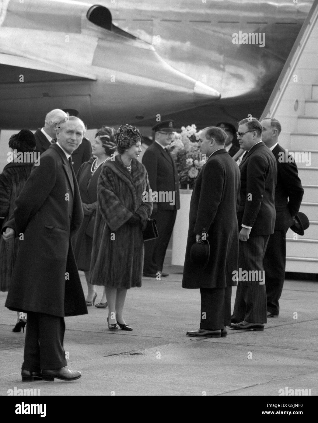 Queen Elizabeth II talks to members of the send-off party before she ...