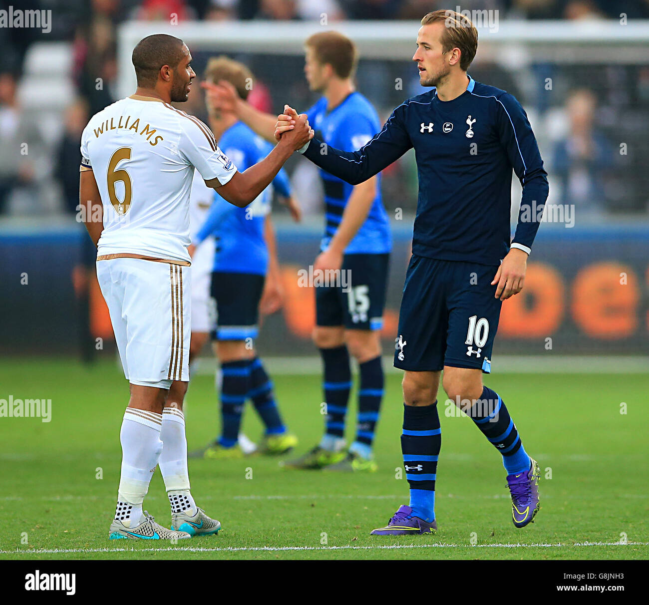 Swansea City's Ashley Williams and Tottenham Hotspur's Harry Kane shake ...