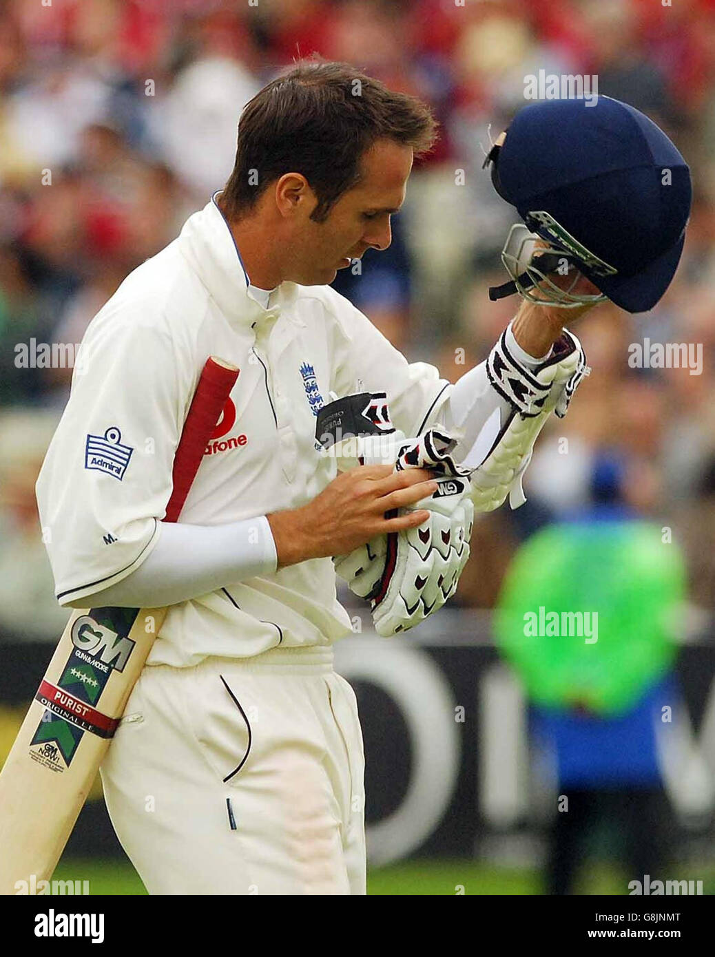 England captain Michael Vaughan leaves the field after being bowled out ...