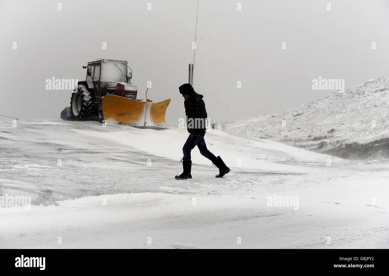 A tractor with a snow plough parked outside the Tan Hill Inn in ...