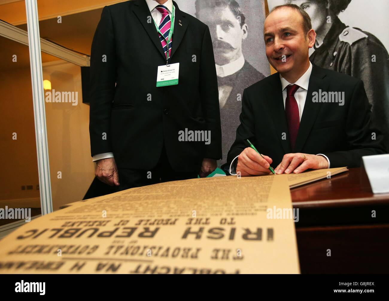 Fianna Fail leader Micheal Martin signs a replica of the 1916 ...
