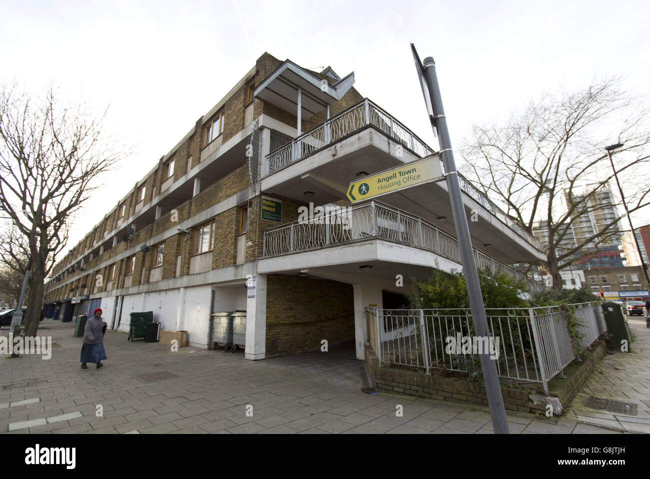 A sign giving directions to the Angell Town Housing Office, in front of ...