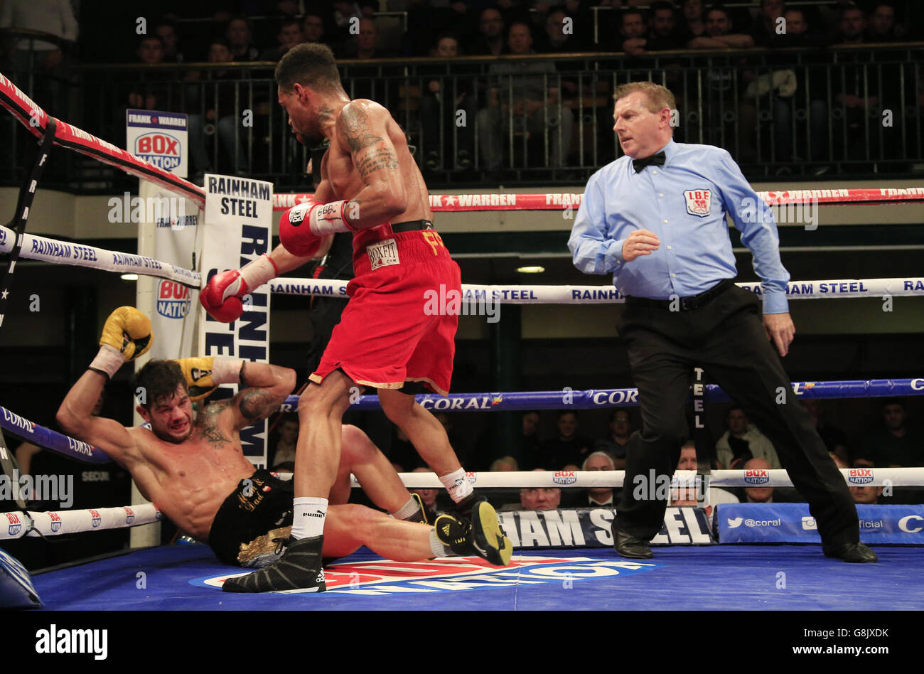 Ahmet Patterson (right) knocks down Ryan Aston during their IBF ...