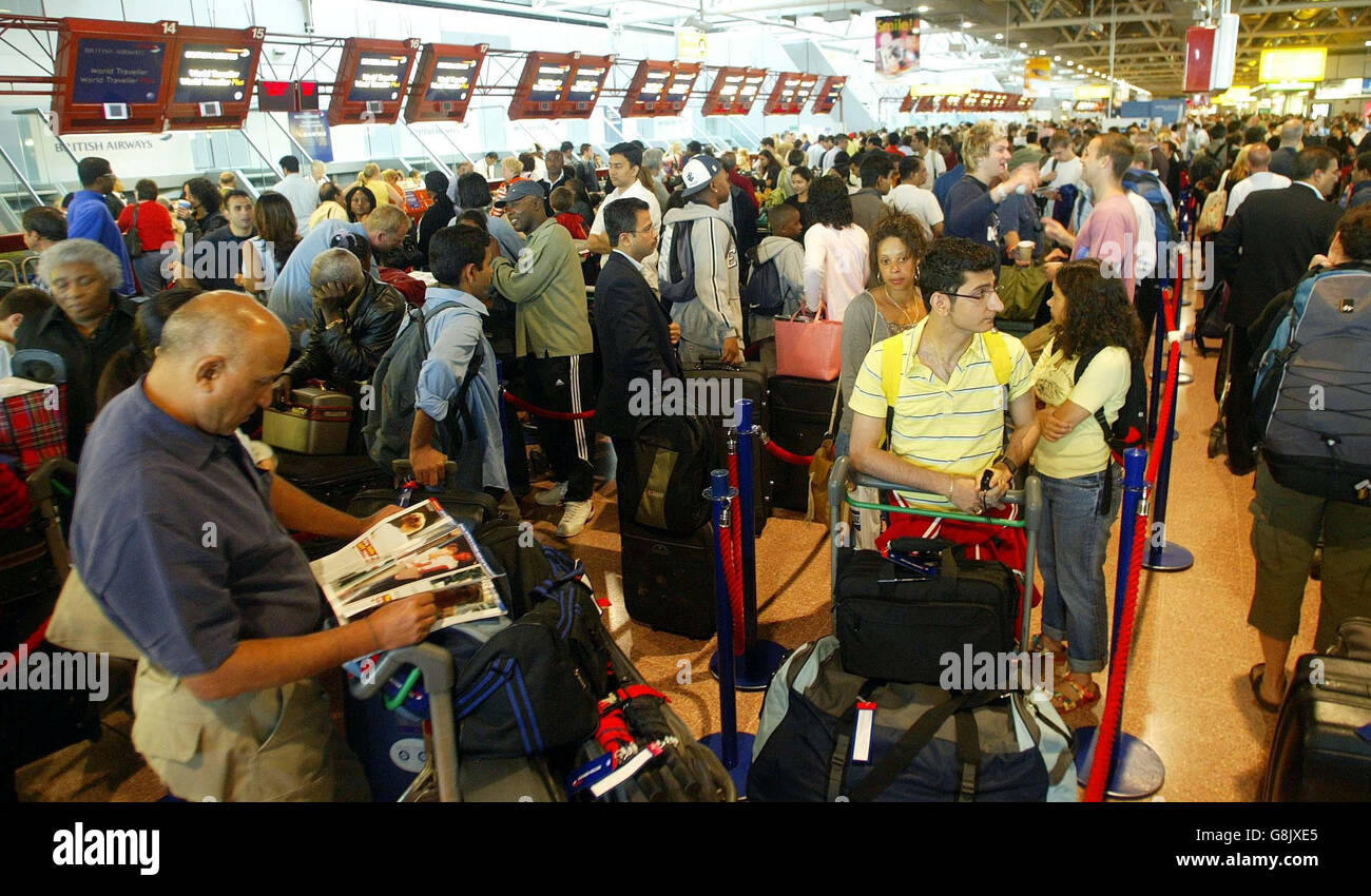 People queue in Heathrow's Terminal 4, as British Airways tries to get ...