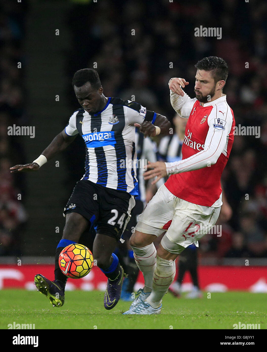 Arsenal's Olivier Giroud and Newcastle United's Cheick Tiote (left ...