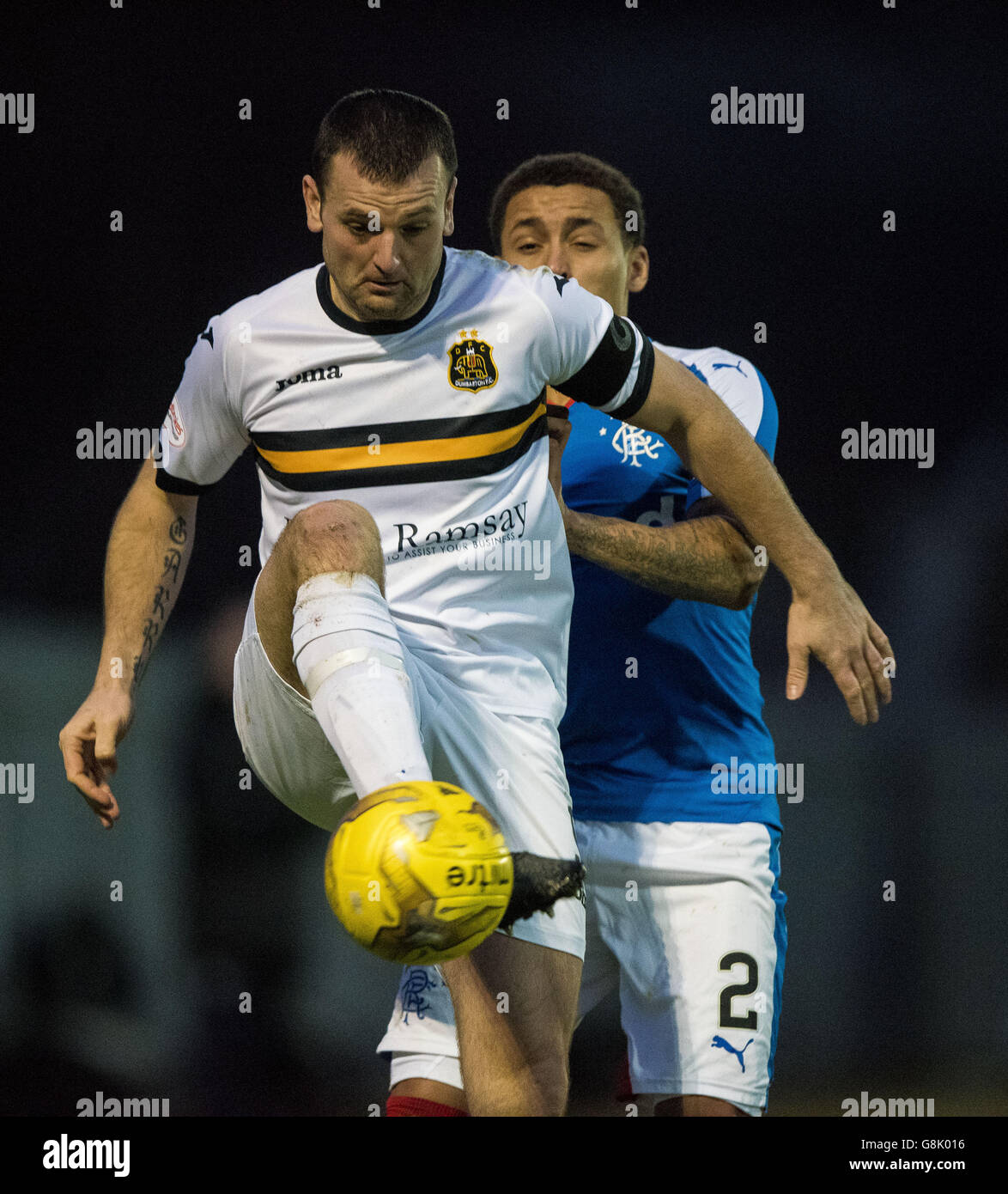 Dumbarton's Mark Doherty (left) and Rangers James Tavernier during the ...